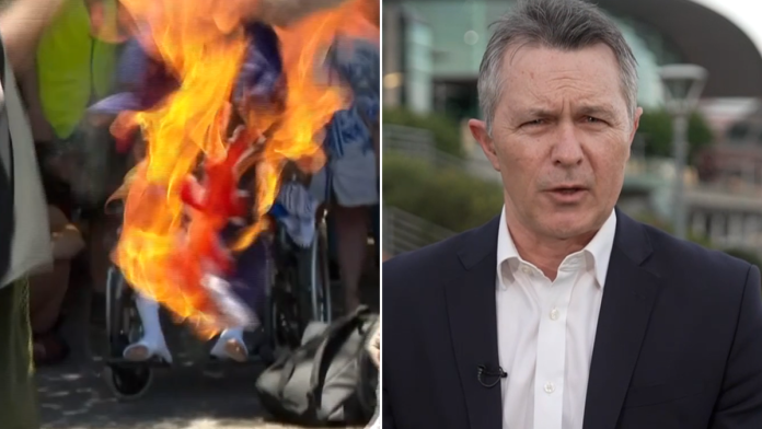 Education Minister Jason Clare labels flag burner ‘an idiot’ as calls ...